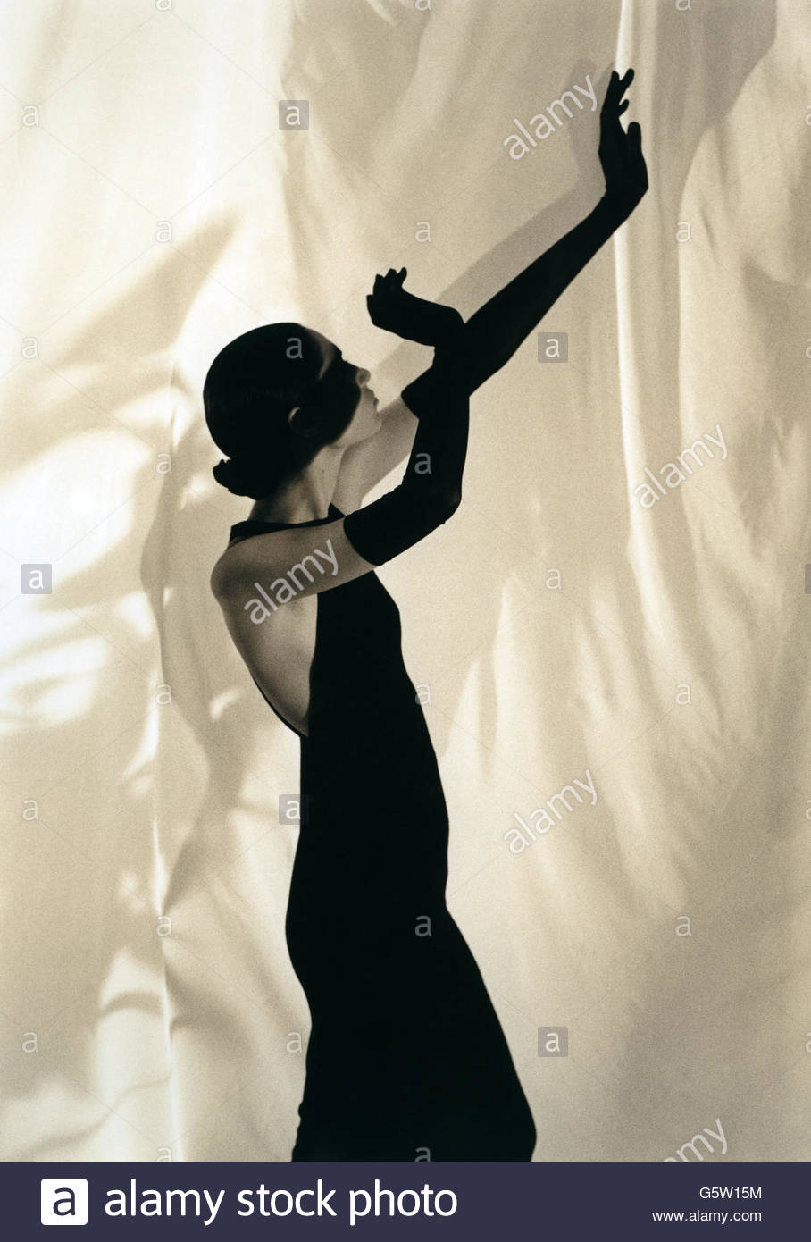 Beautiful Brunette In Black Dress Stock Photos & Beautiful Brunette In ...