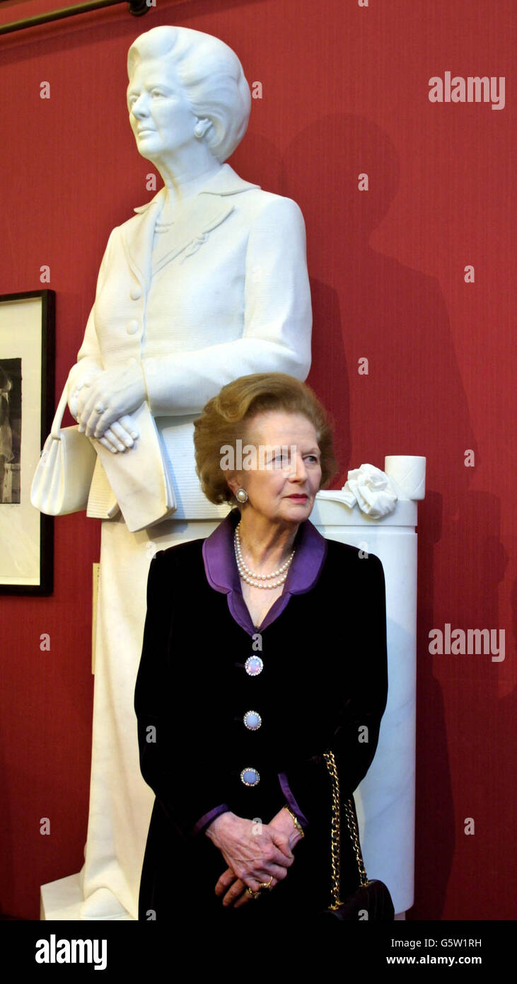 Former British Prime Minister, Margaret Thatcher stands next to her ...