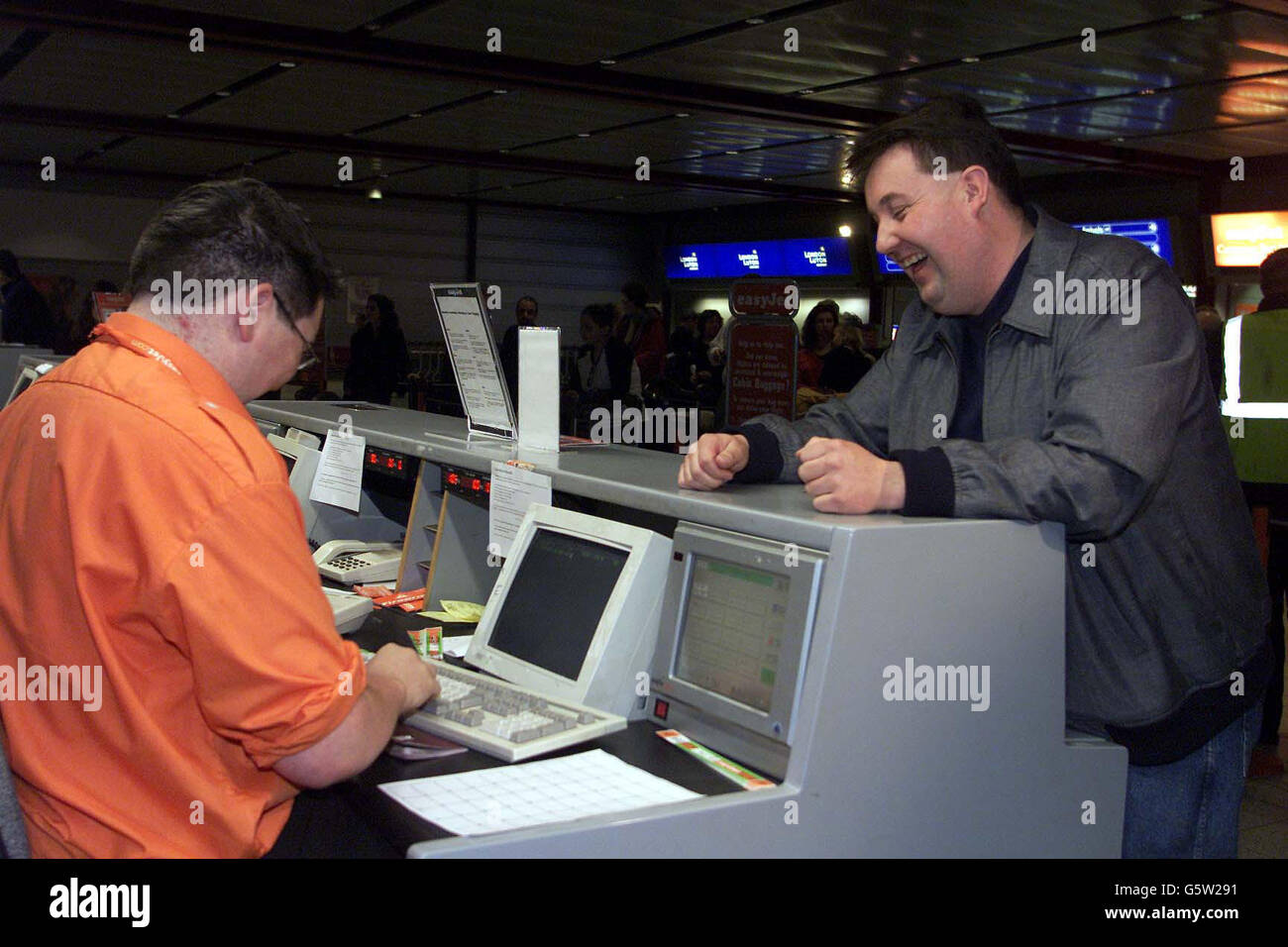 Gary Fagan from Leicester checks in for his flight to Athens at Luton Airport, where he will ...