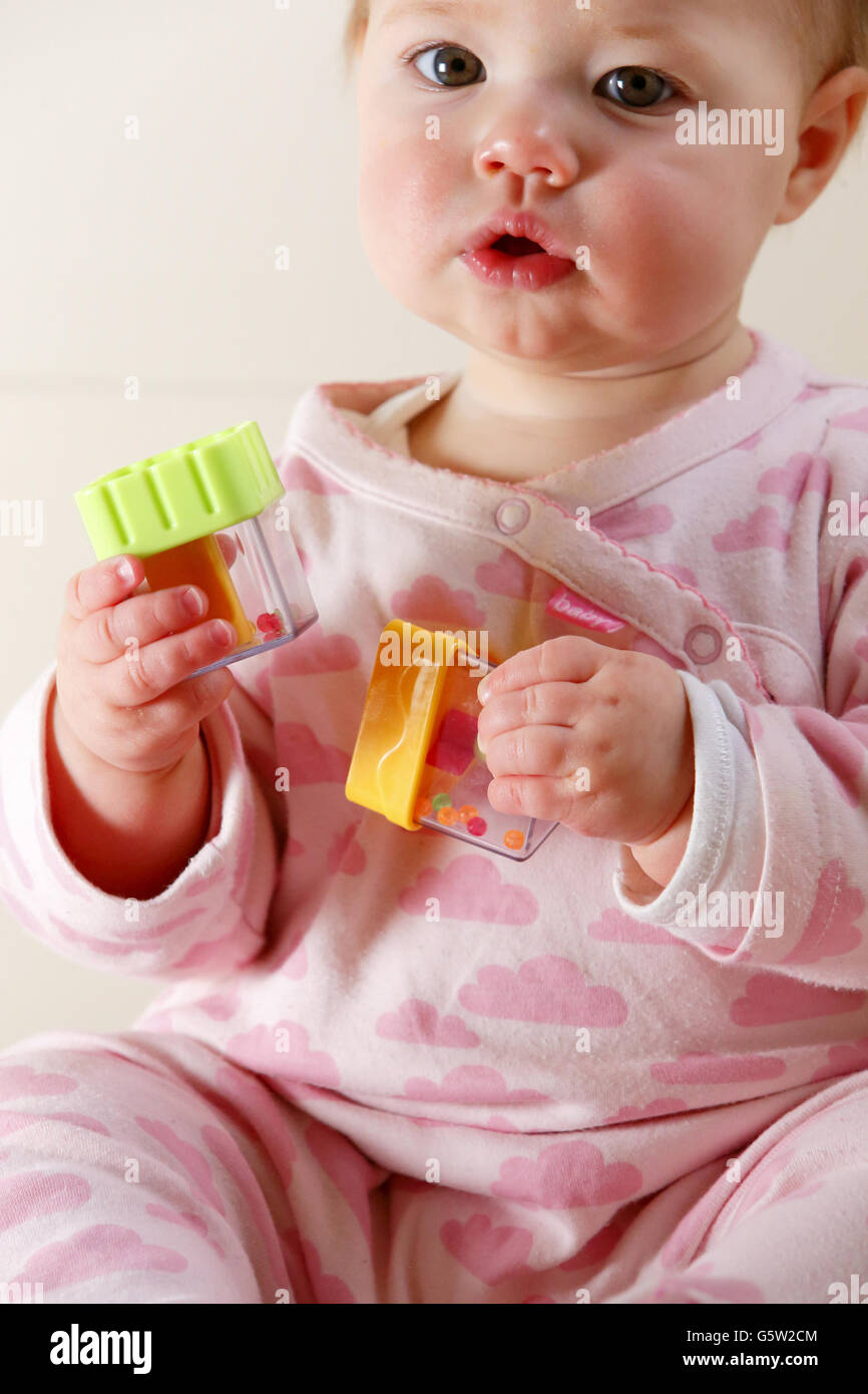 STOCK Baby. A baby plays with toys Stock Photo - Alamy