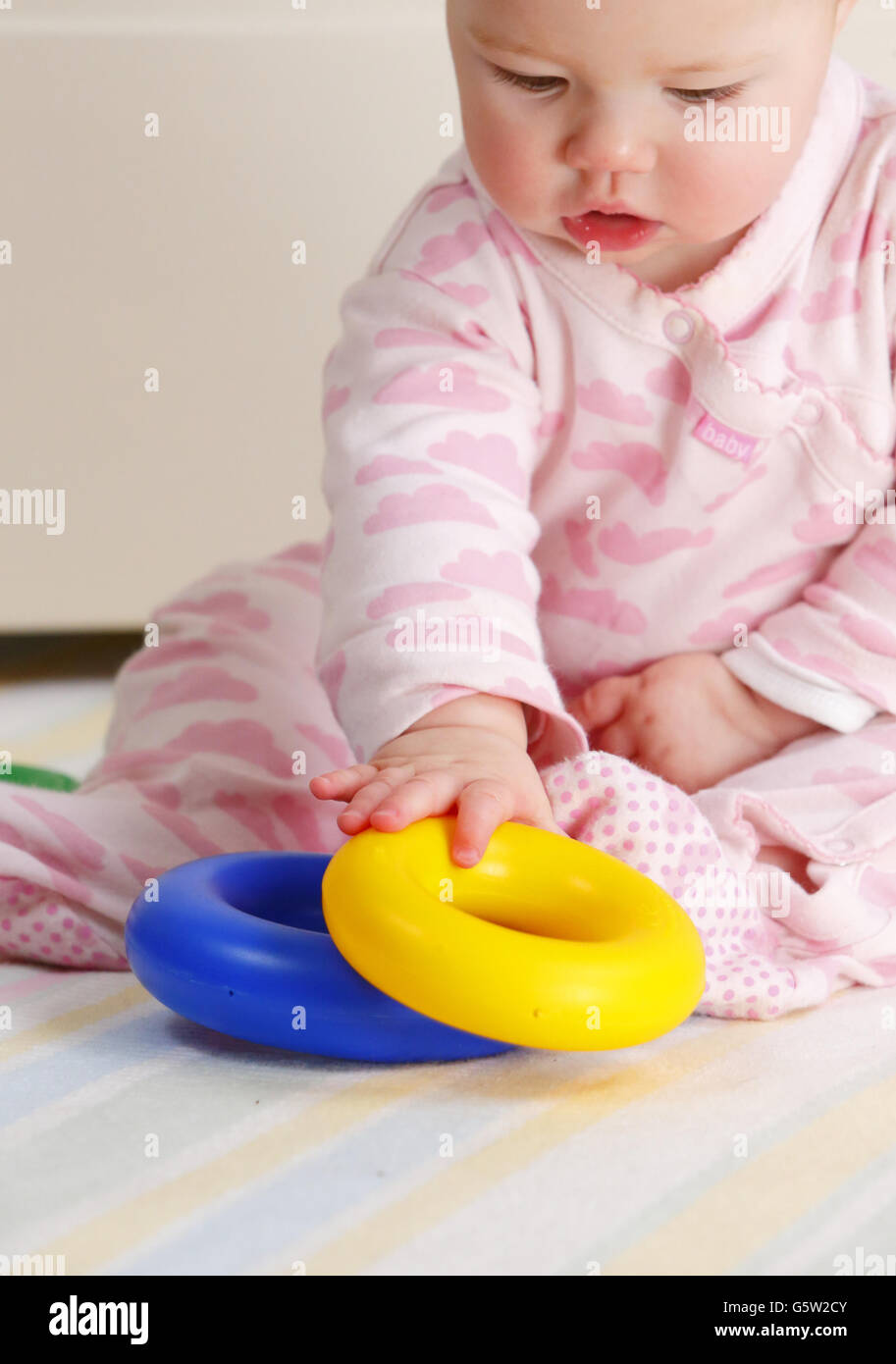 STOCK Baby. A baby plays with toys Stock Photo - Alamy