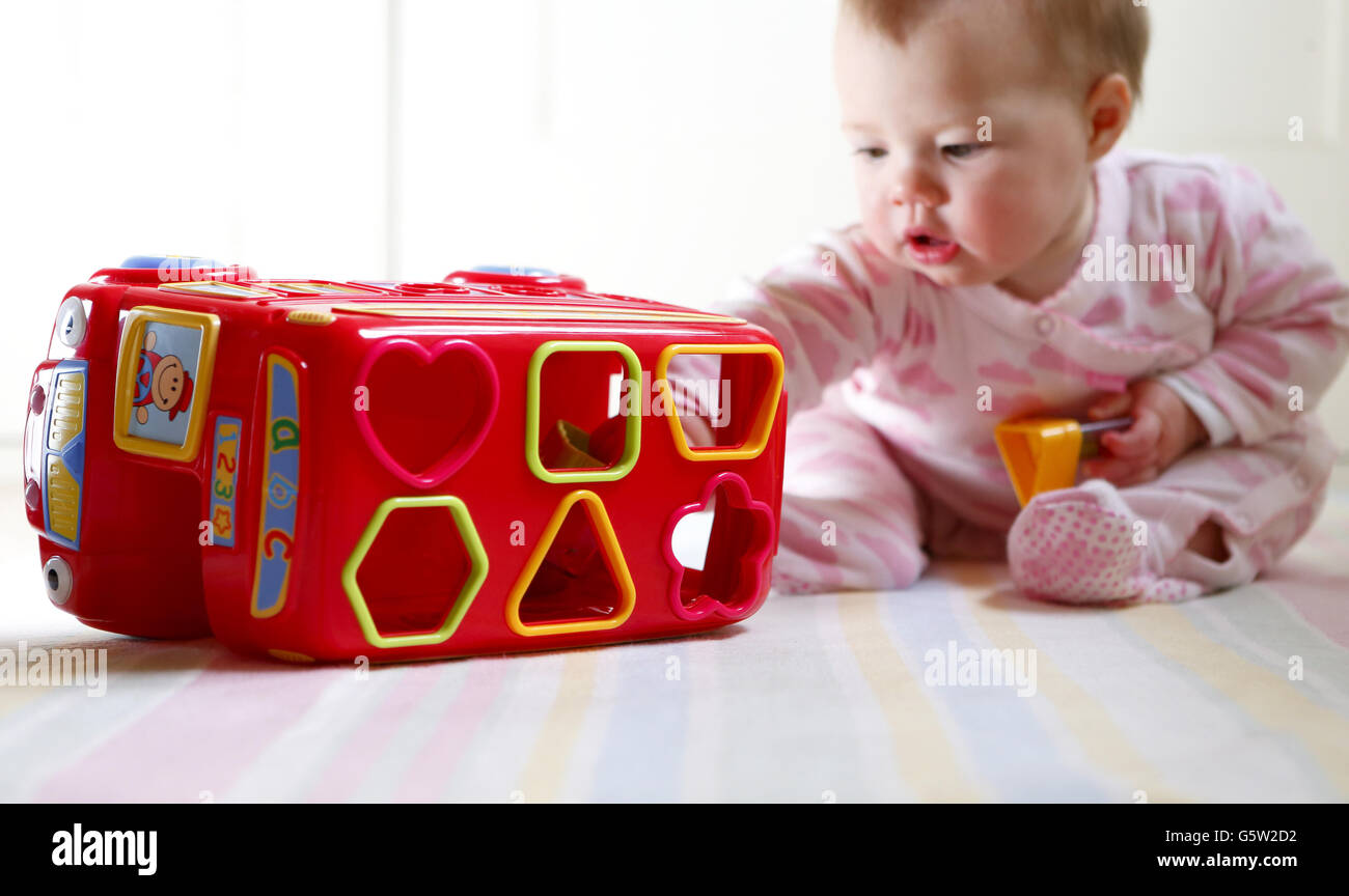 STOCK Baby. A baby plays with toys Stock Photo - Alamy