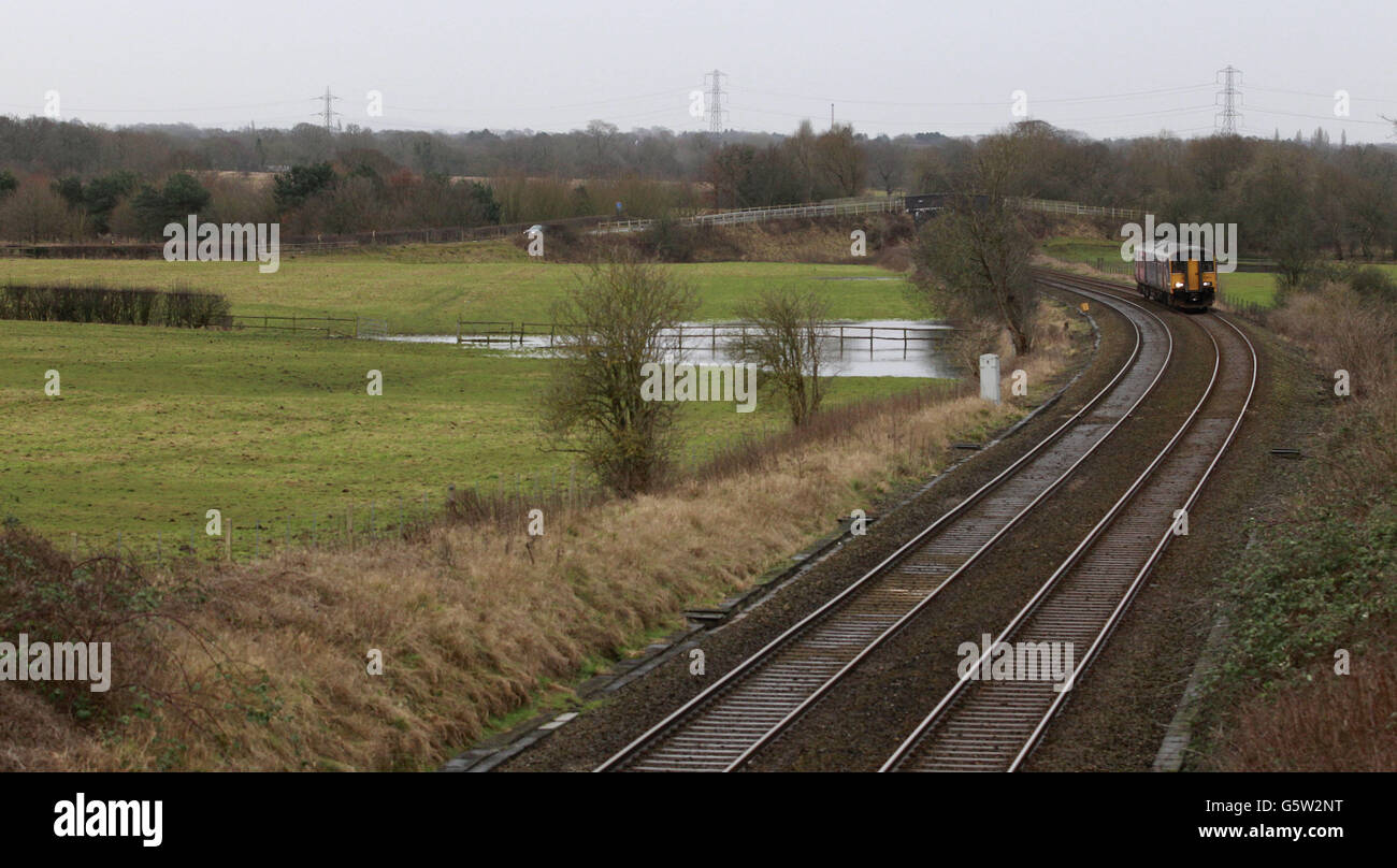 HS2 high-speed rail plan. A train makes its way towards Ashley station in Ashley, Cheshire Stock ...