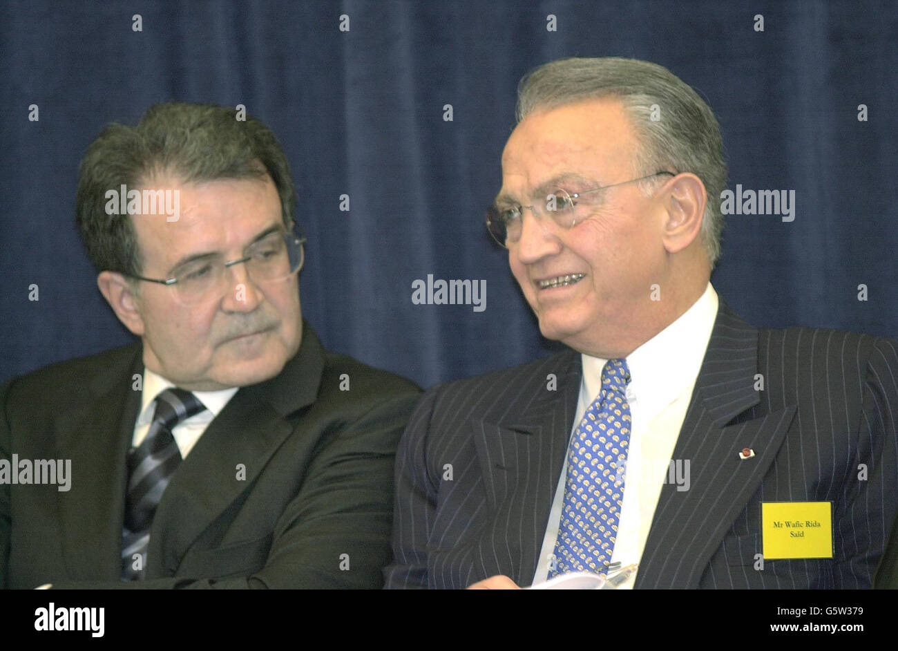 President of the European Commission, Romano Prodi (left) sits with ...