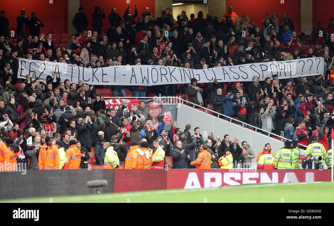 Liverpool fans display signs protesting ticket prices in the stands ...