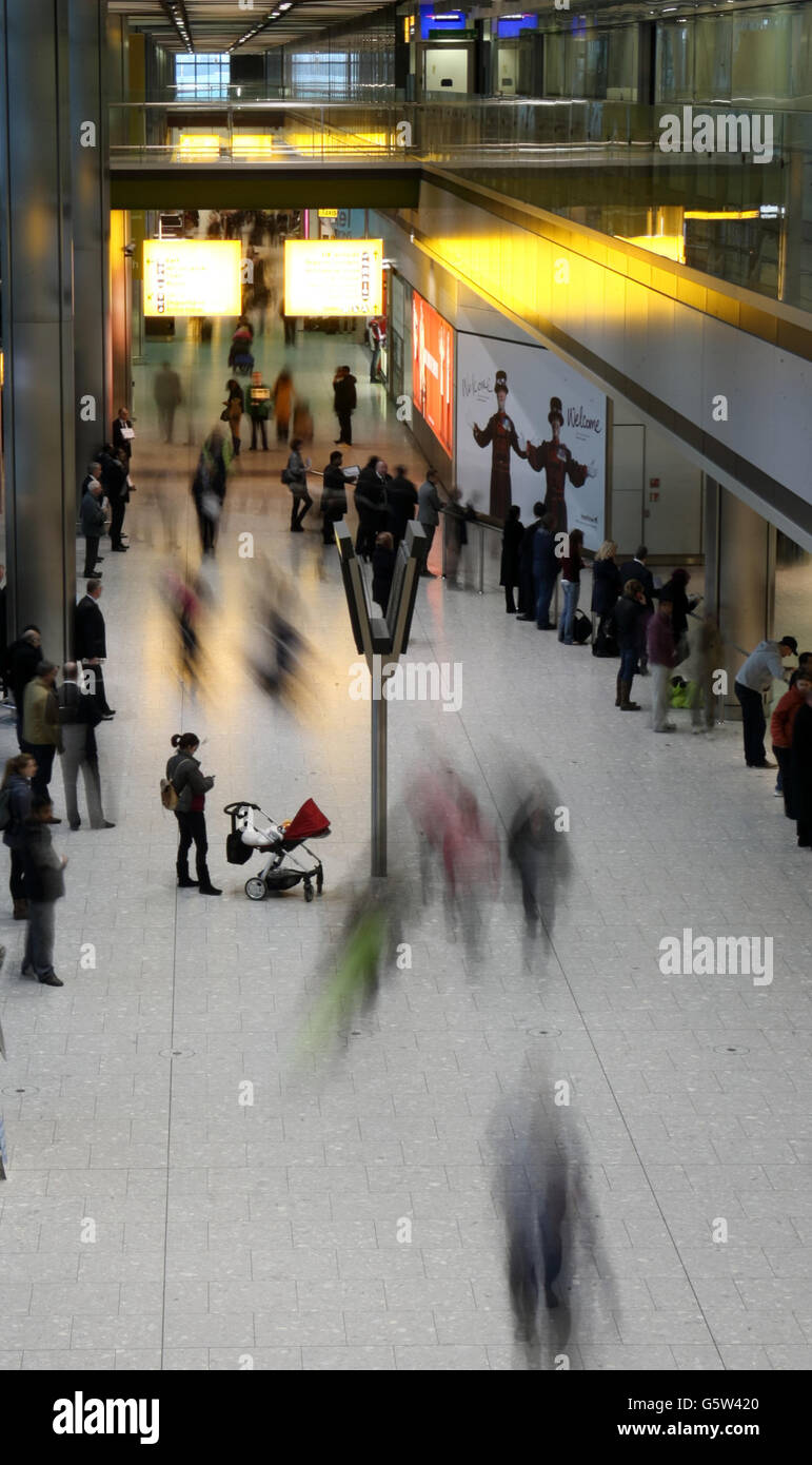 Passengers arrive to check-in at Terminal 5 of Heathrow Airport Stock ...