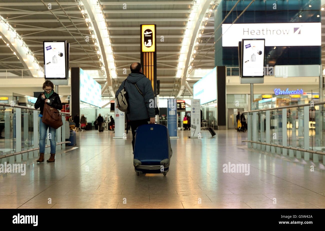 Passengers arrive to check-in at Terminal 5 of Heathrow Airport Stock ...