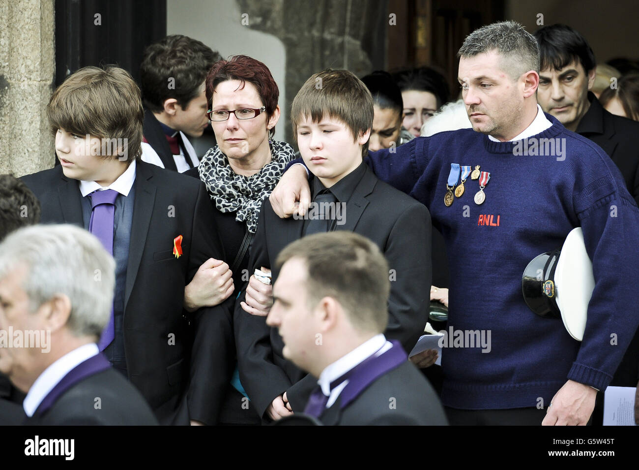 Mourners react after the funeral of Jordan Cobb, 16, who died after ...