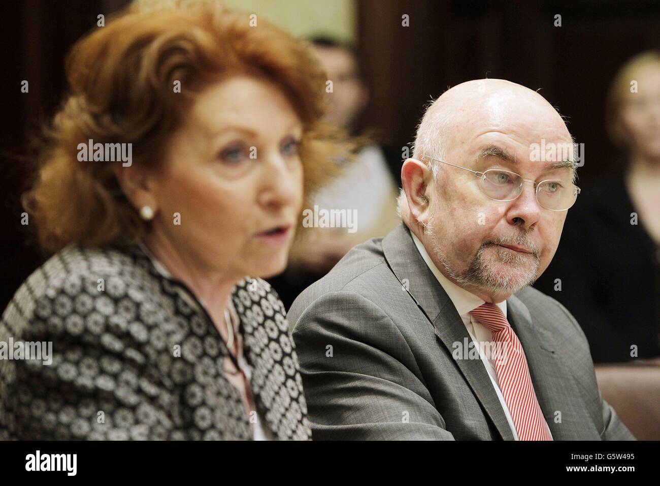 Education Minister, Ruairi Quinn, listens to Junior Minister at the ...