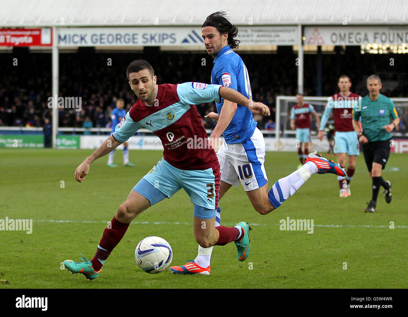 Burnley's Daniel Lafferty (left) and Peterborough United's George Boyd ...