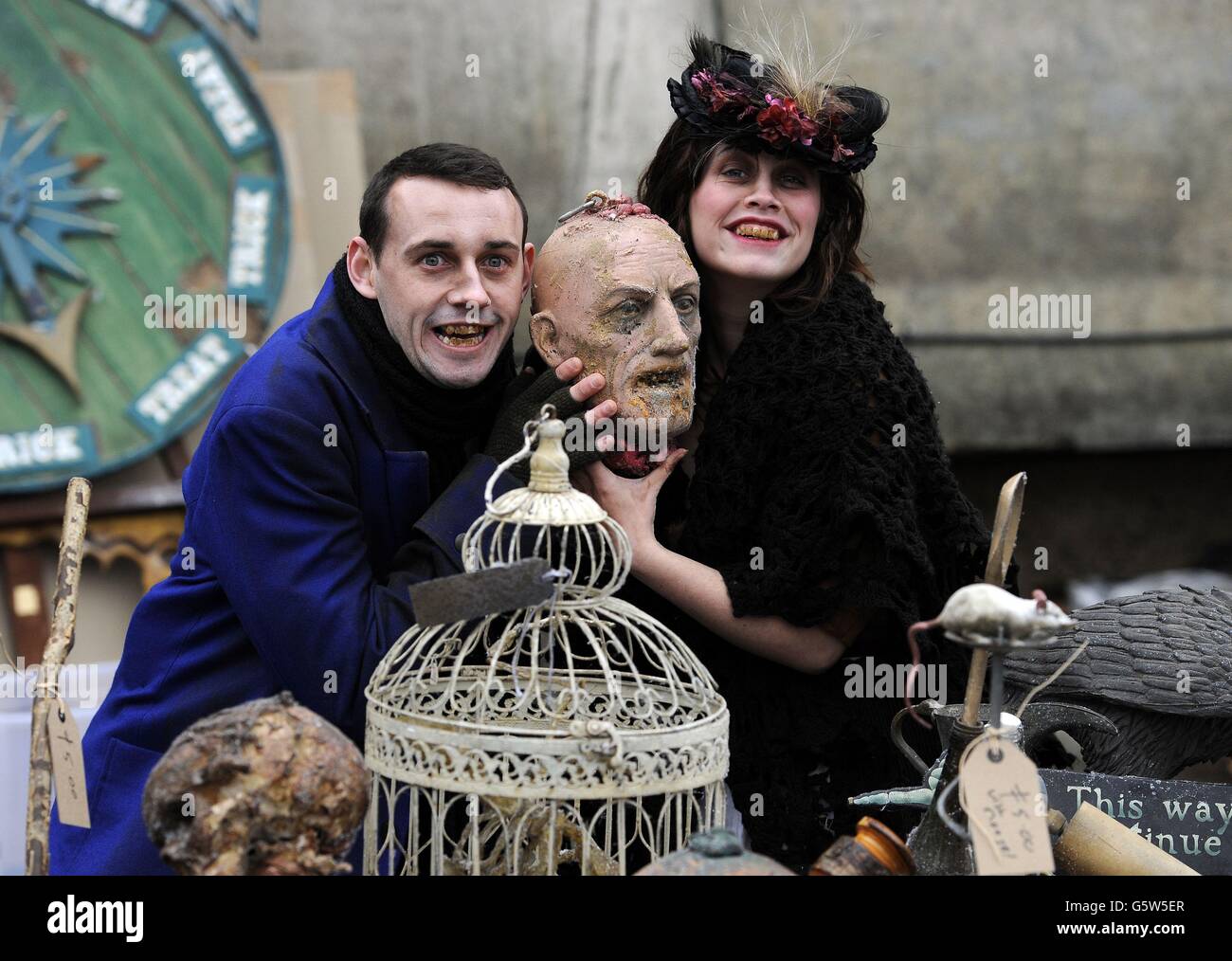 Actors dressed as characters 'Robin Graves' and 'Mrs. Miggins' display ...