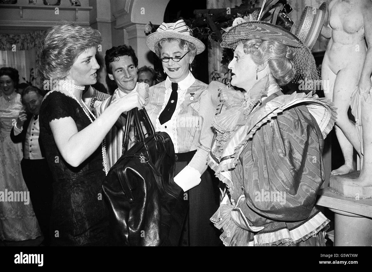 The Princess of wales receives a prop from the play 'The Importance of ...