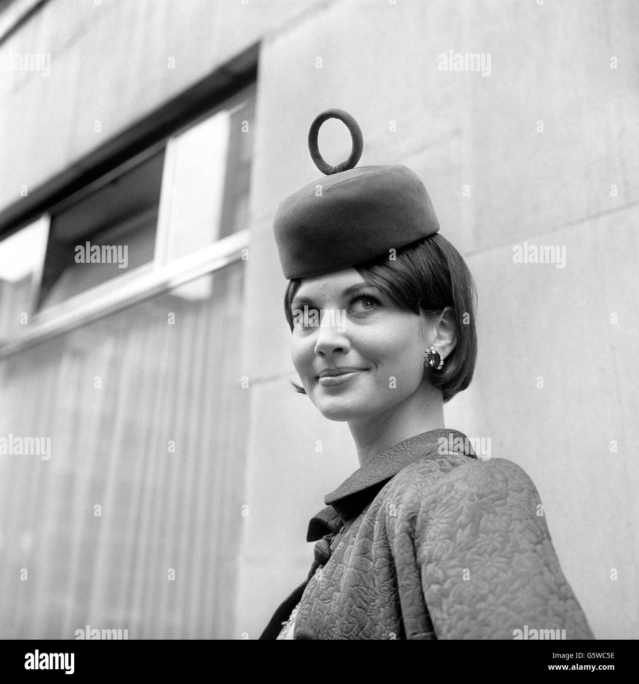 Topped by a ring is this pert pillbox hat worn by Pat Coombs at a ...
