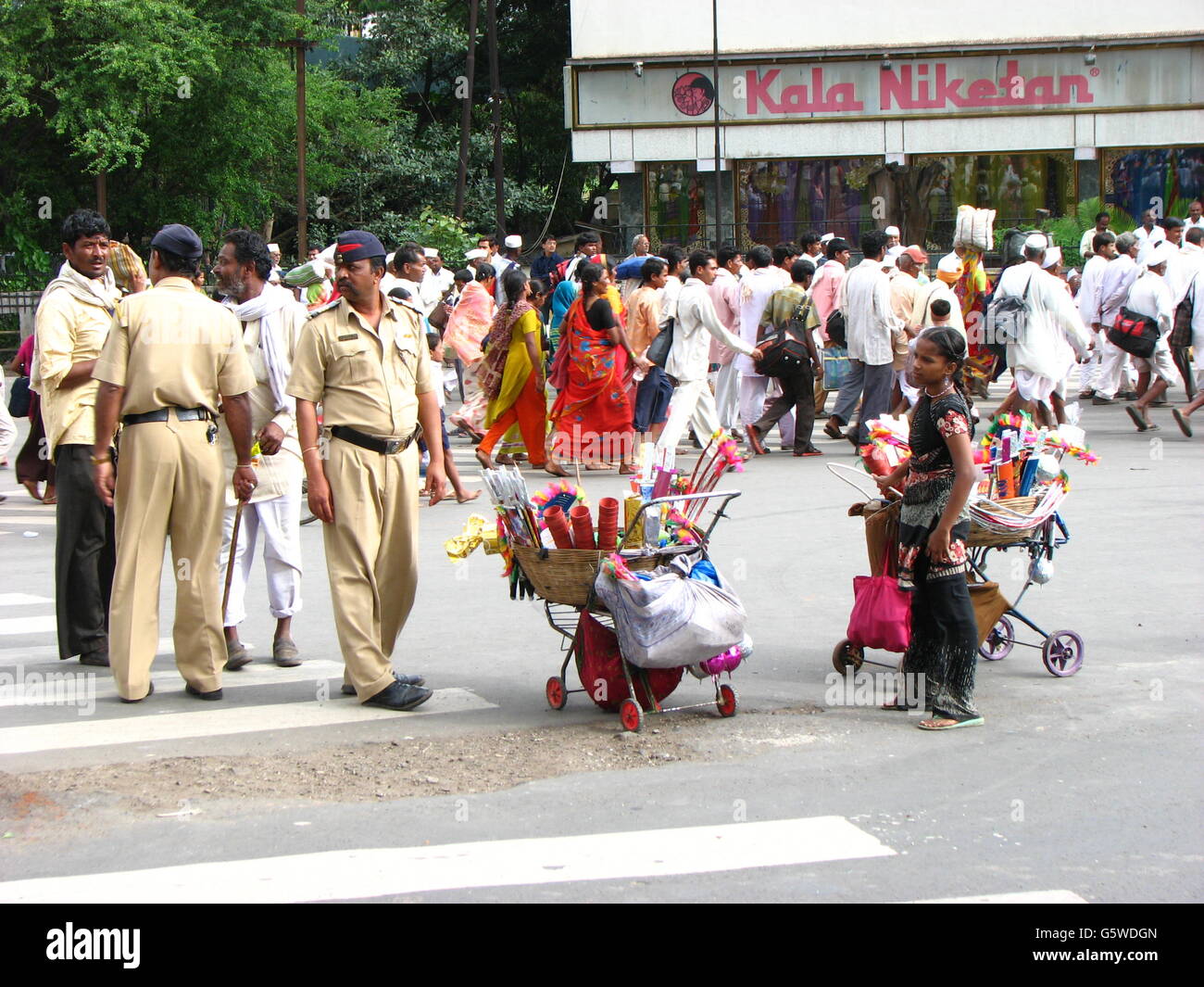 Police keeping a vigil during an indian pilgrimmage Stock Photo - Alamy