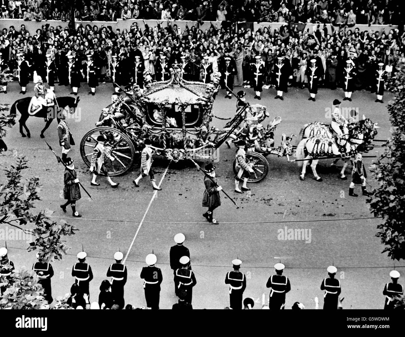 The Royal State Coach carrying The Queen and the Duke of Edinburgh ...