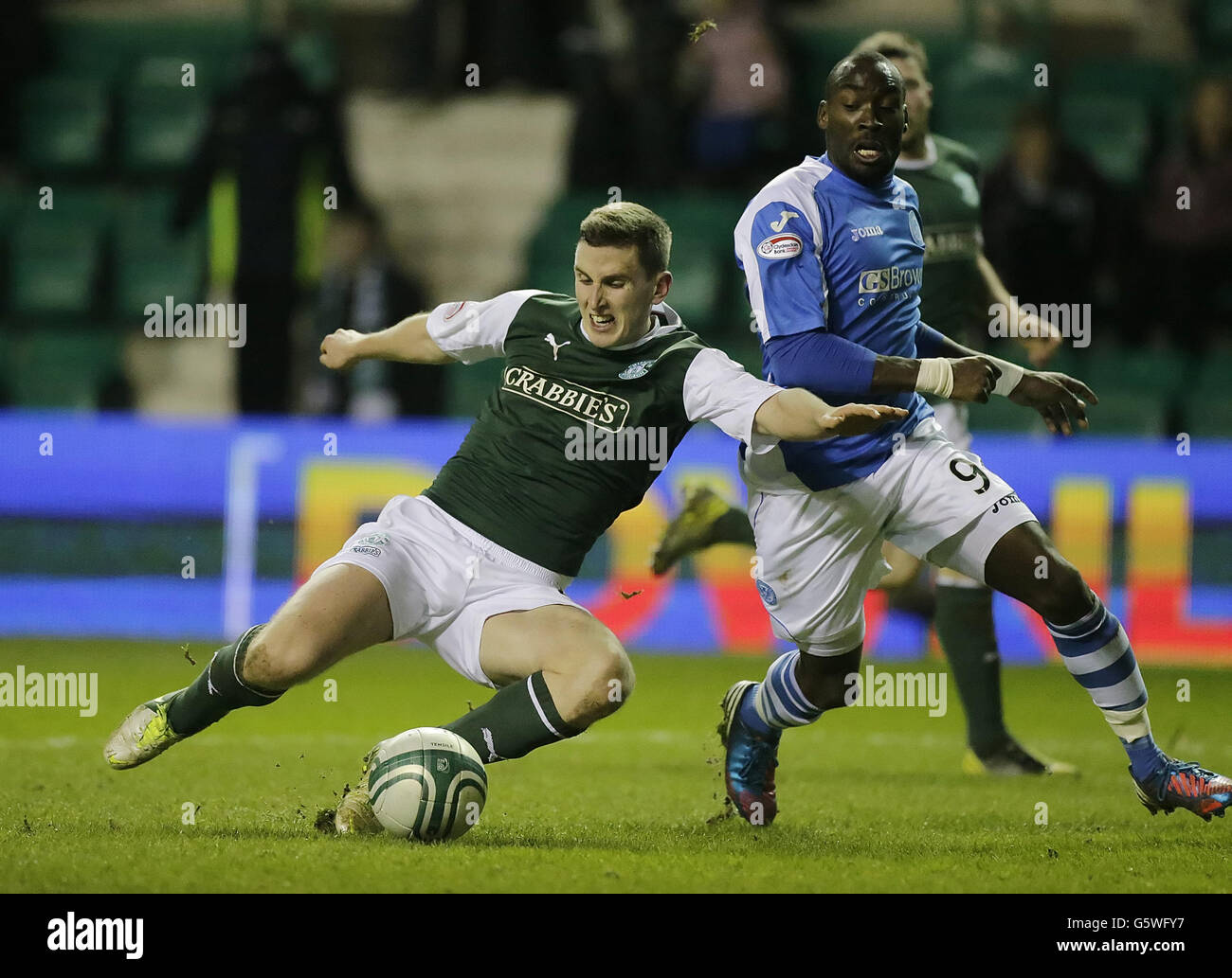 Hibernian's Paul Hanlon and St Johnstone's Gregory Tade fight for the ...