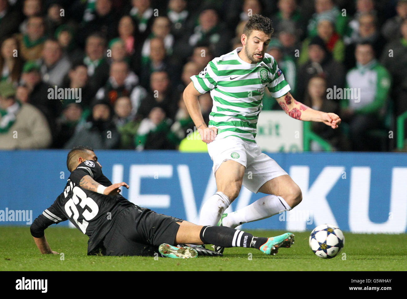 Celtic's Charlie Mulgrew (right) evades the challenge by Juventus ...
