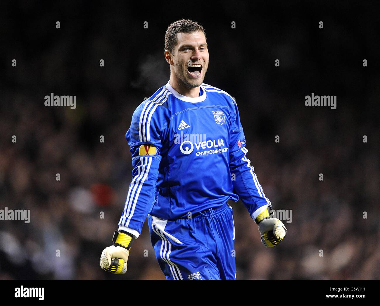 Lyon goalkeeper Remy Vercoutre celebrates after teammate Samuel Umtiti ...