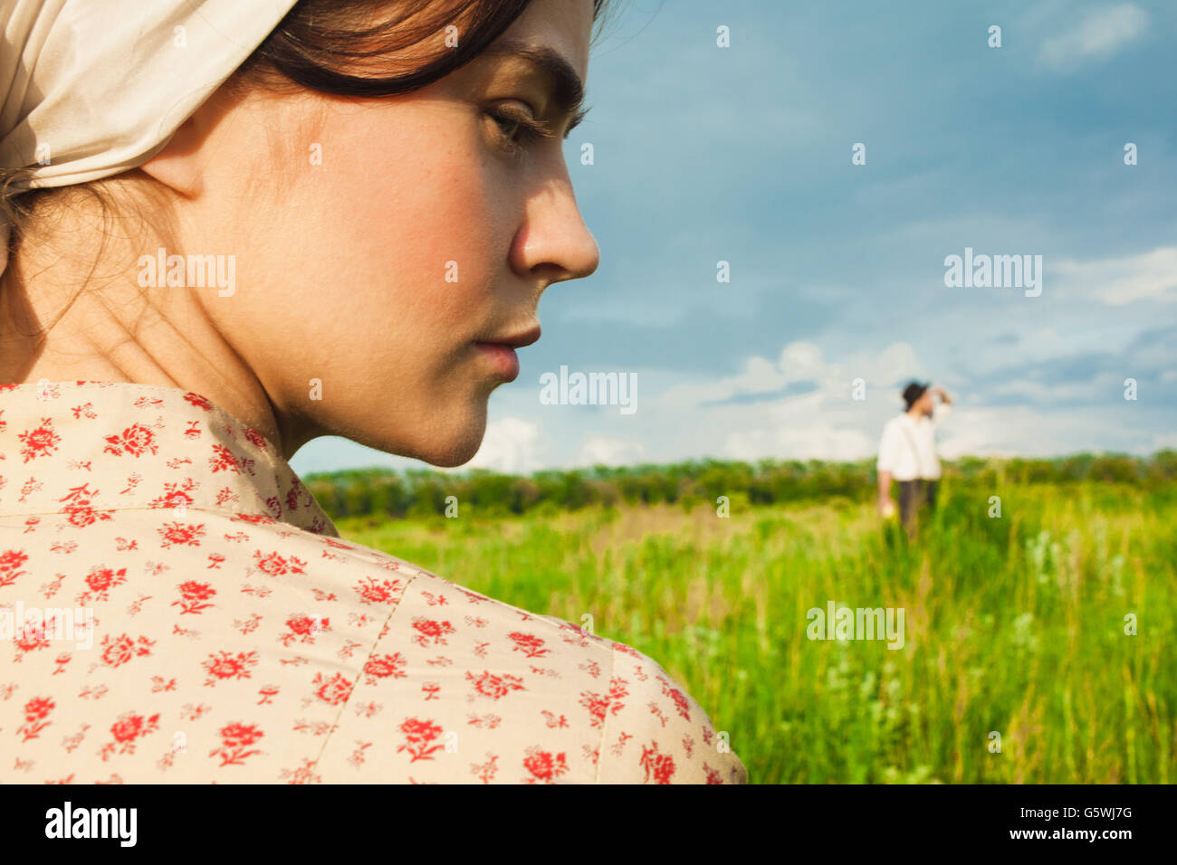 The healthy rural life. The woman and man in the green field Stock ...