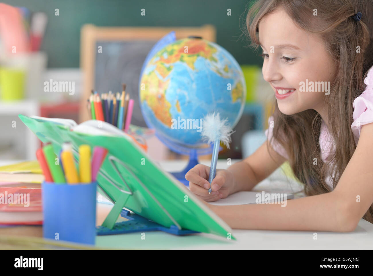 Portrait of a cute student girl at class Stock Photo - Alamy