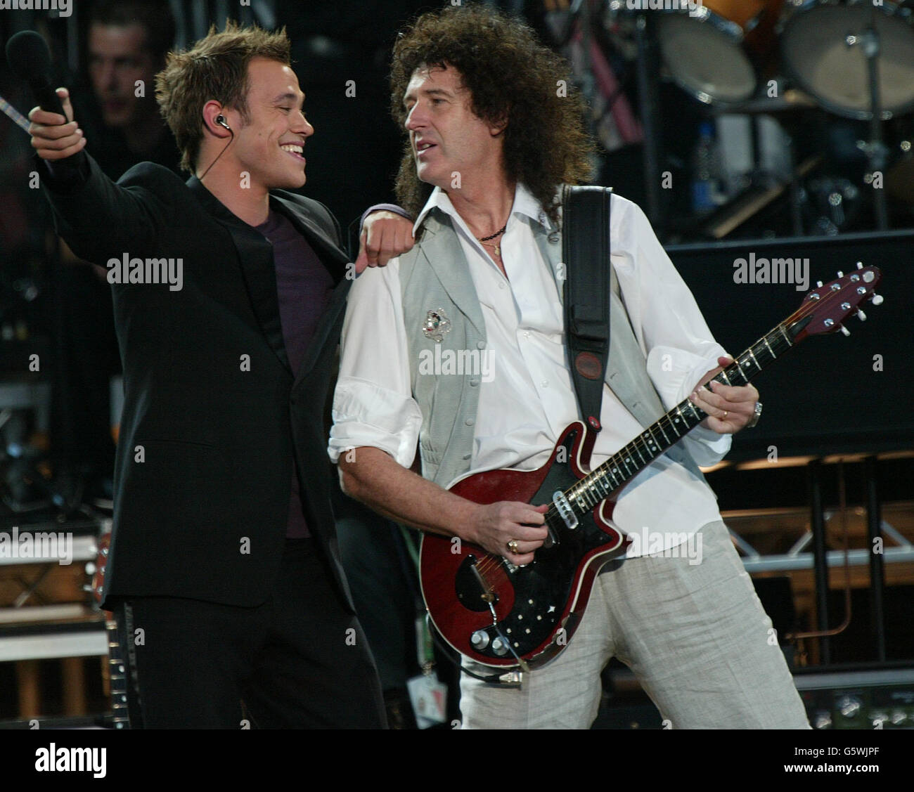 Pop Idol winner Will Young performs with Brian May of Queen at the ...