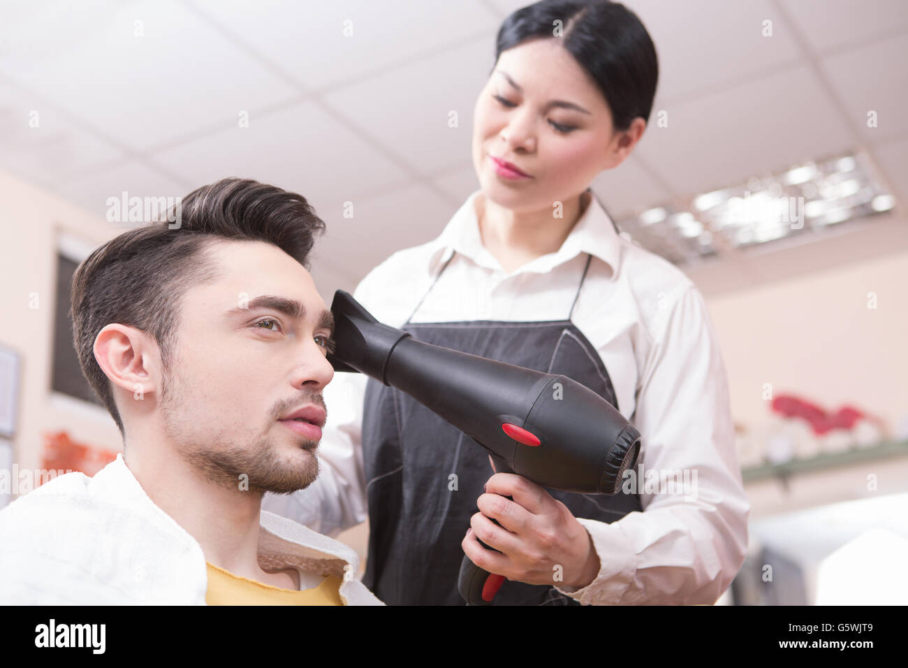 Handsome man in hairdressing saloon Stock Photo - Alamy
