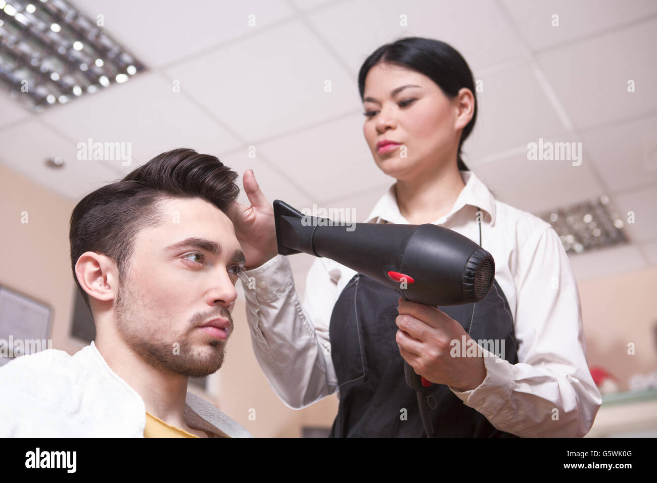 Handsome man in hairdressing saloon Stock Photo - Alamy