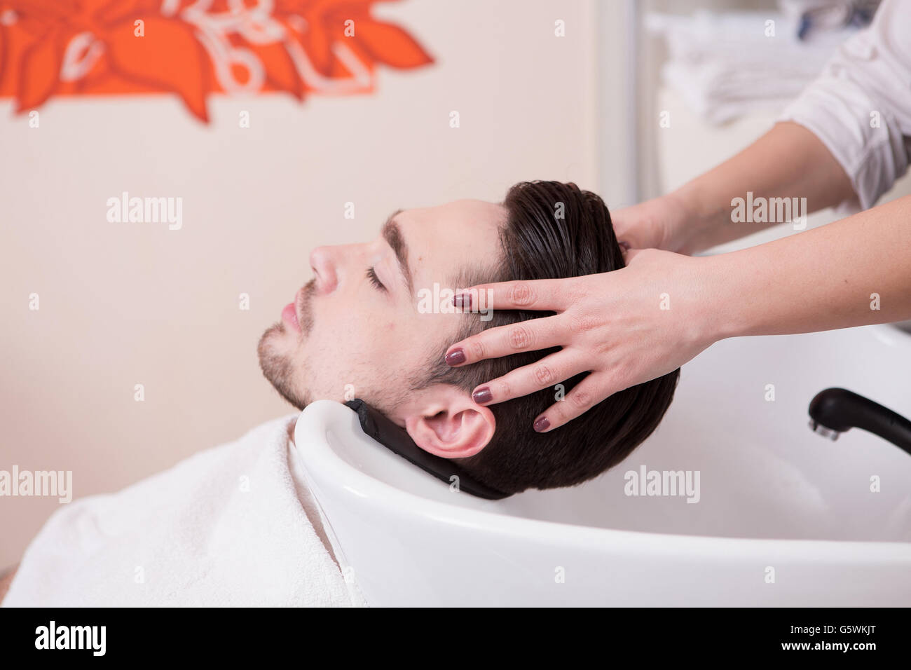 Handsome man in hairdressing saloon Stock Photo - Alamy