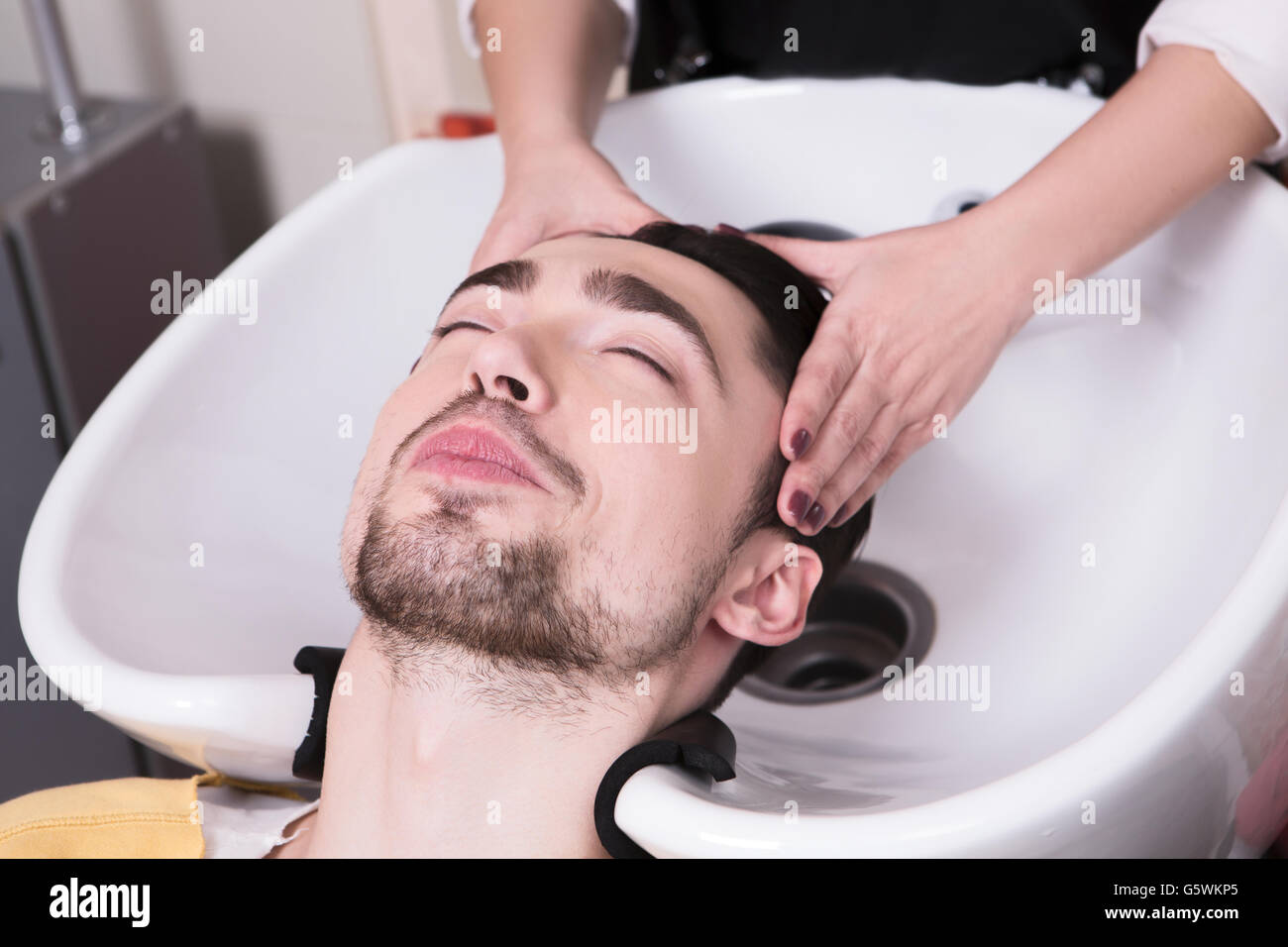 Handsome man in hairdressing saloon Stock Photo - Alamy