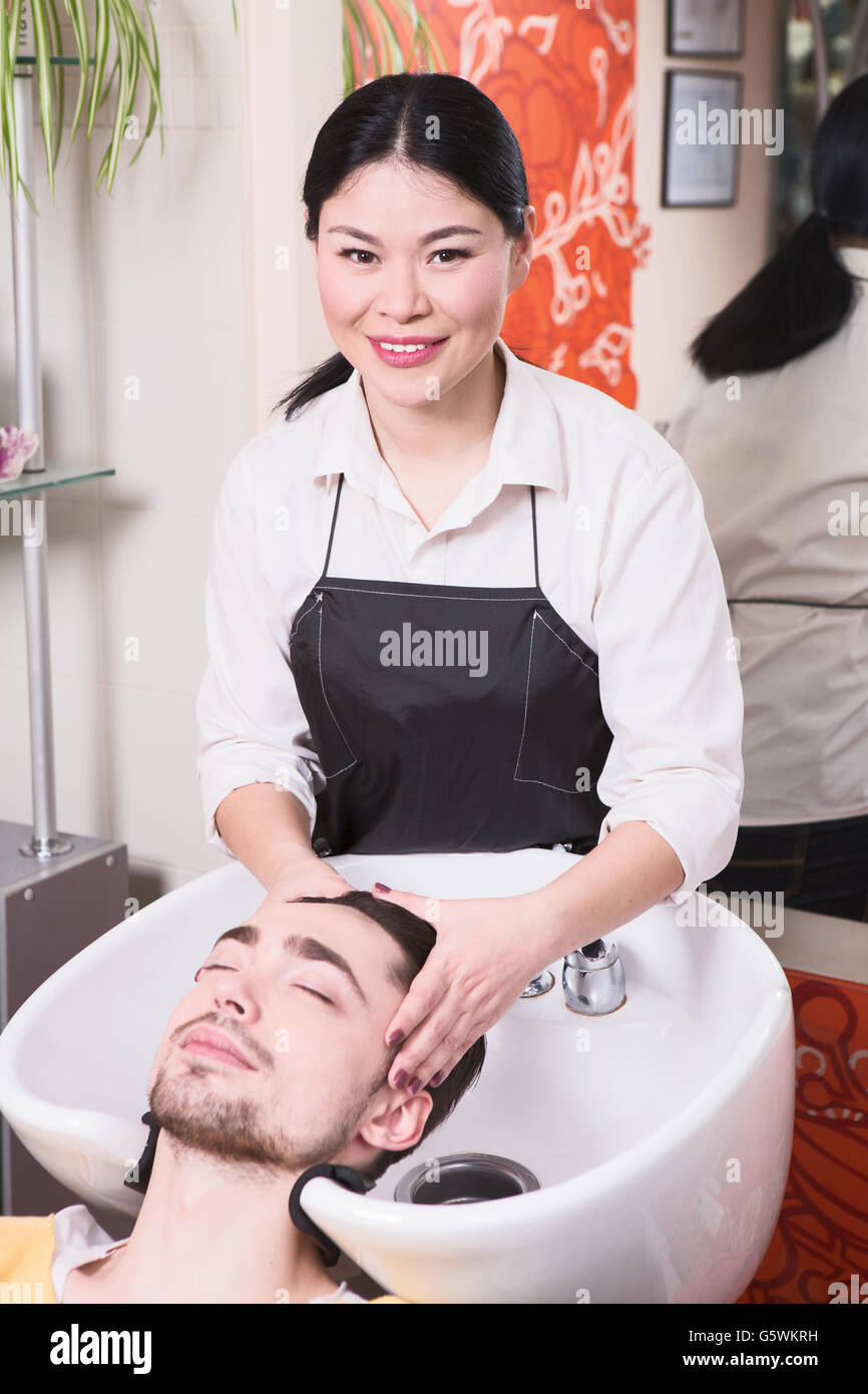 Handsome man in hairdressing saloon Stock Photo - Alamy