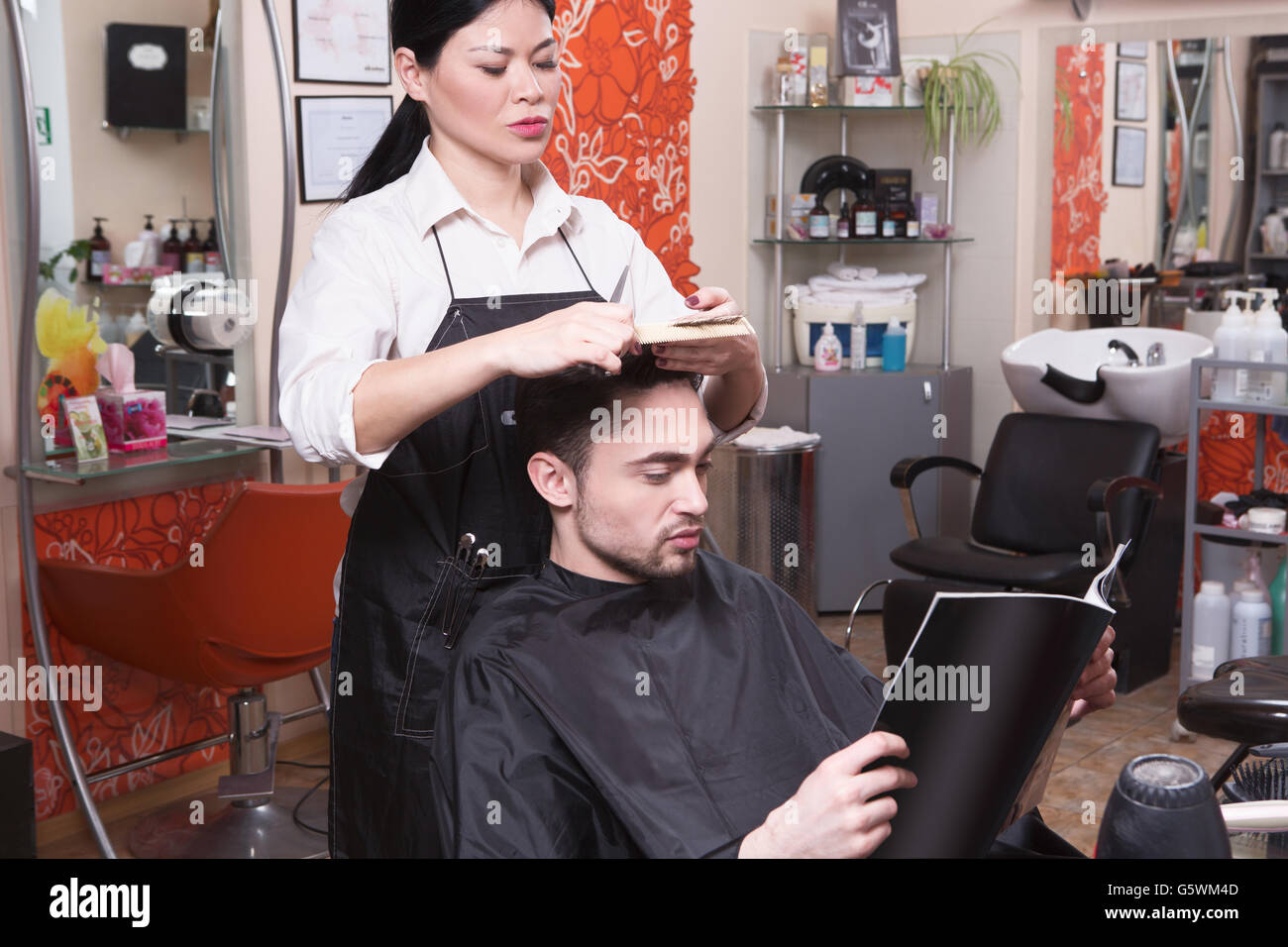 Handsome man in hairdressing saloon Stock Photo - Alamy