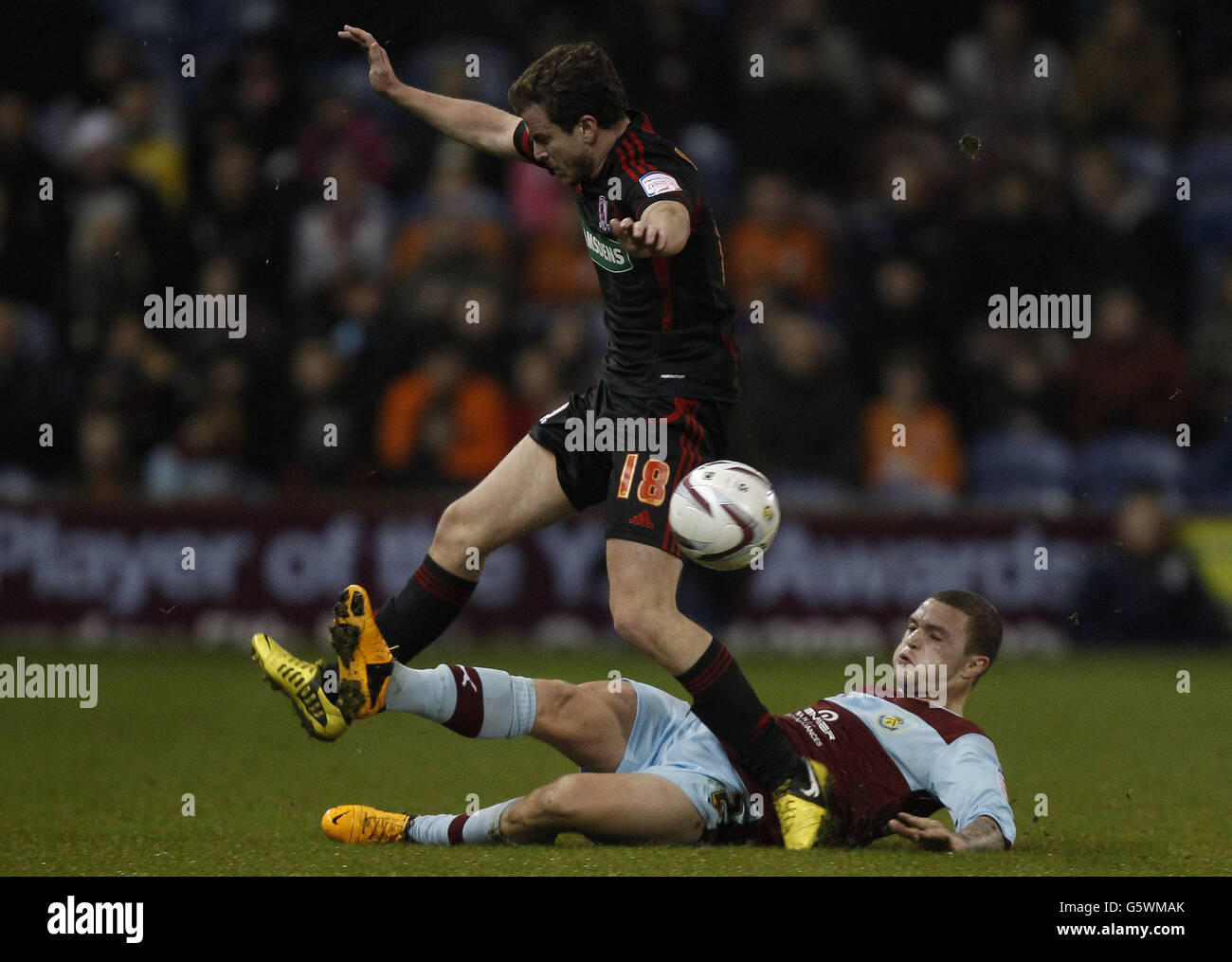 Burnley's Kieran Trippier (floor) tackles Middlesbrough's Andrew ...