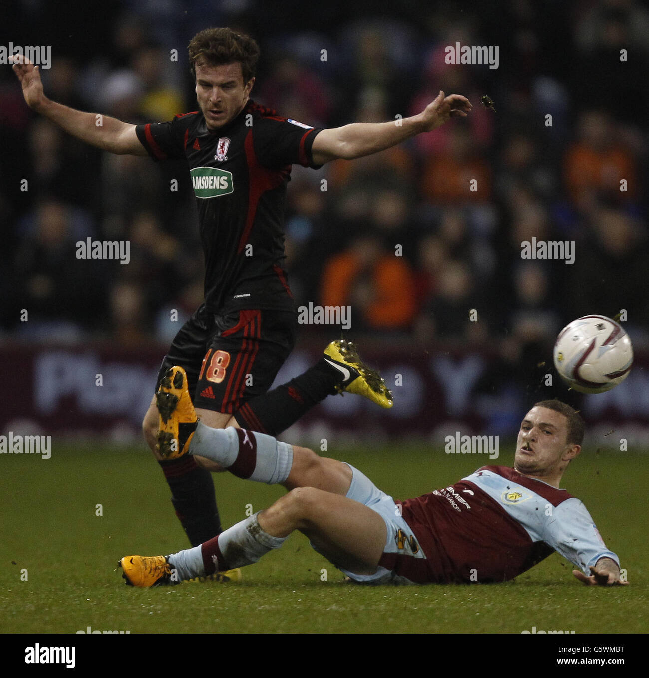 Burnley's Kieran Trippier (floor)tackles Middlesbrough's Andrew ...
