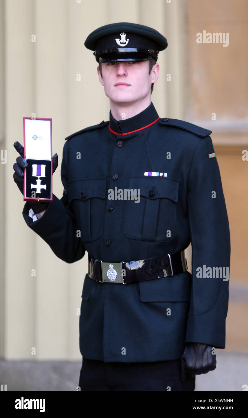 Lance Corporal Matthew Wilson Proudly Holds His Military Cross For
