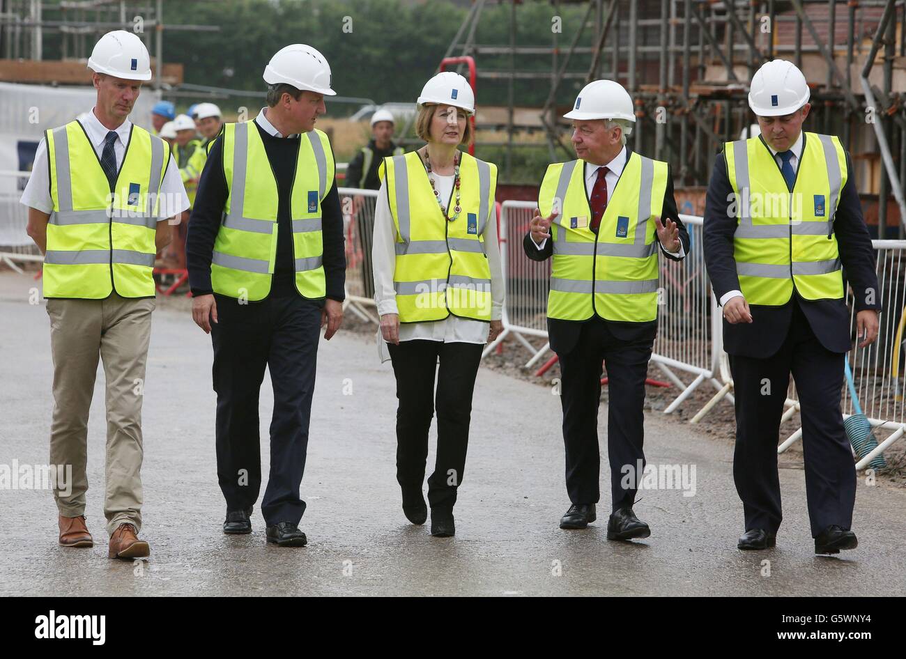Prime Minister David Cameron and Labour's Harriet Harman listen to ...
