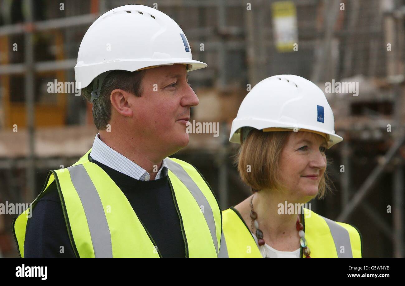 Prime Minister David Cameron and Labour's Harriet Harman listen to ...