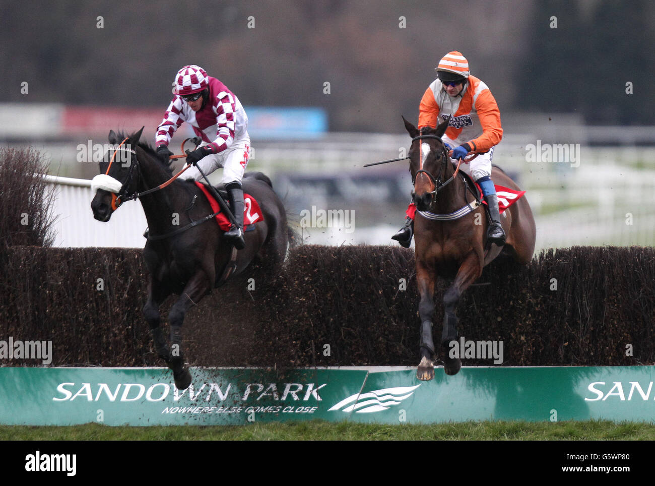 Goring One (right) ridden by Andrew Thornton jumps the last on the way ...
