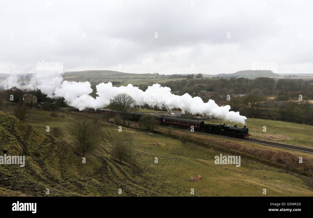 A steam train makes its way through irwell vale in hi-res stock ...