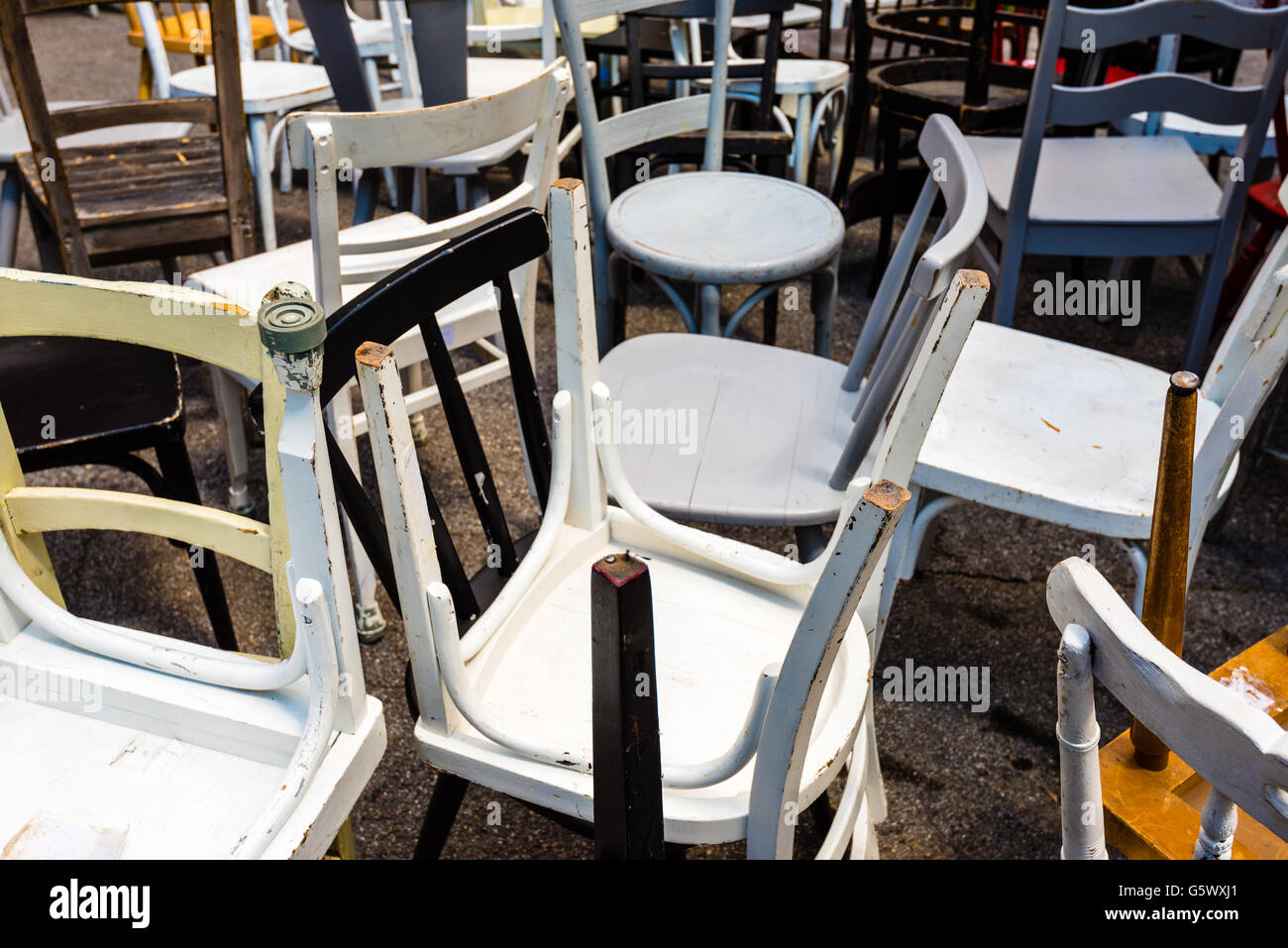 Collection of different used old chairs Stock Photo - Alamy