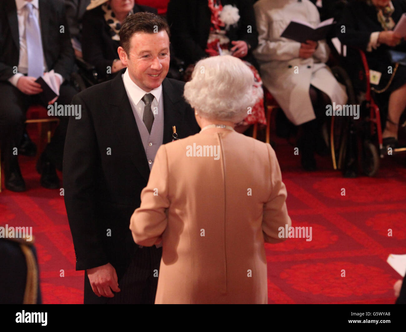 Robert Croft receives his Member of the British Empire (MBE) medal from ...