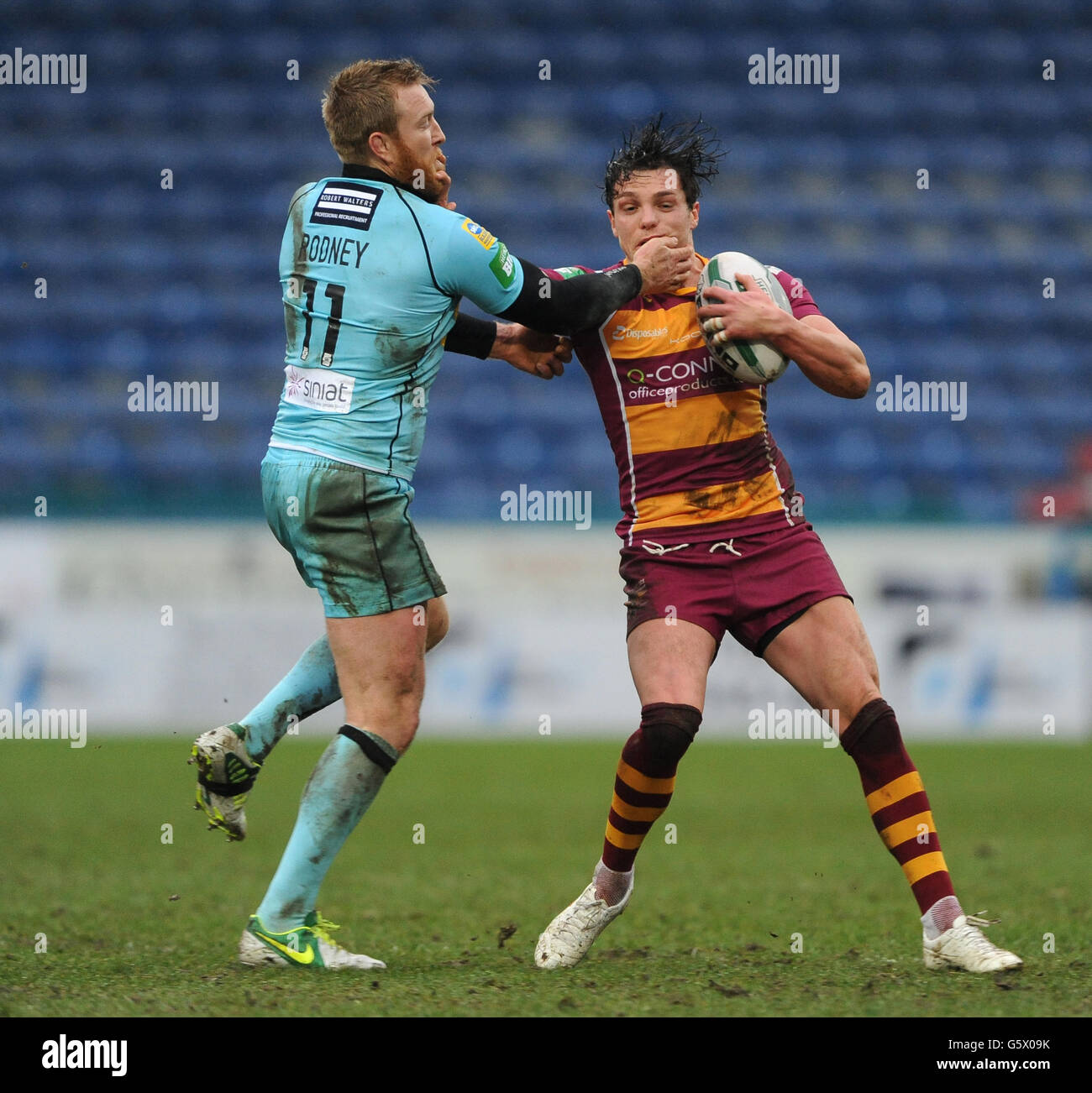 Huddersfield giants scott grix is tackled by london broncos shane hi ...