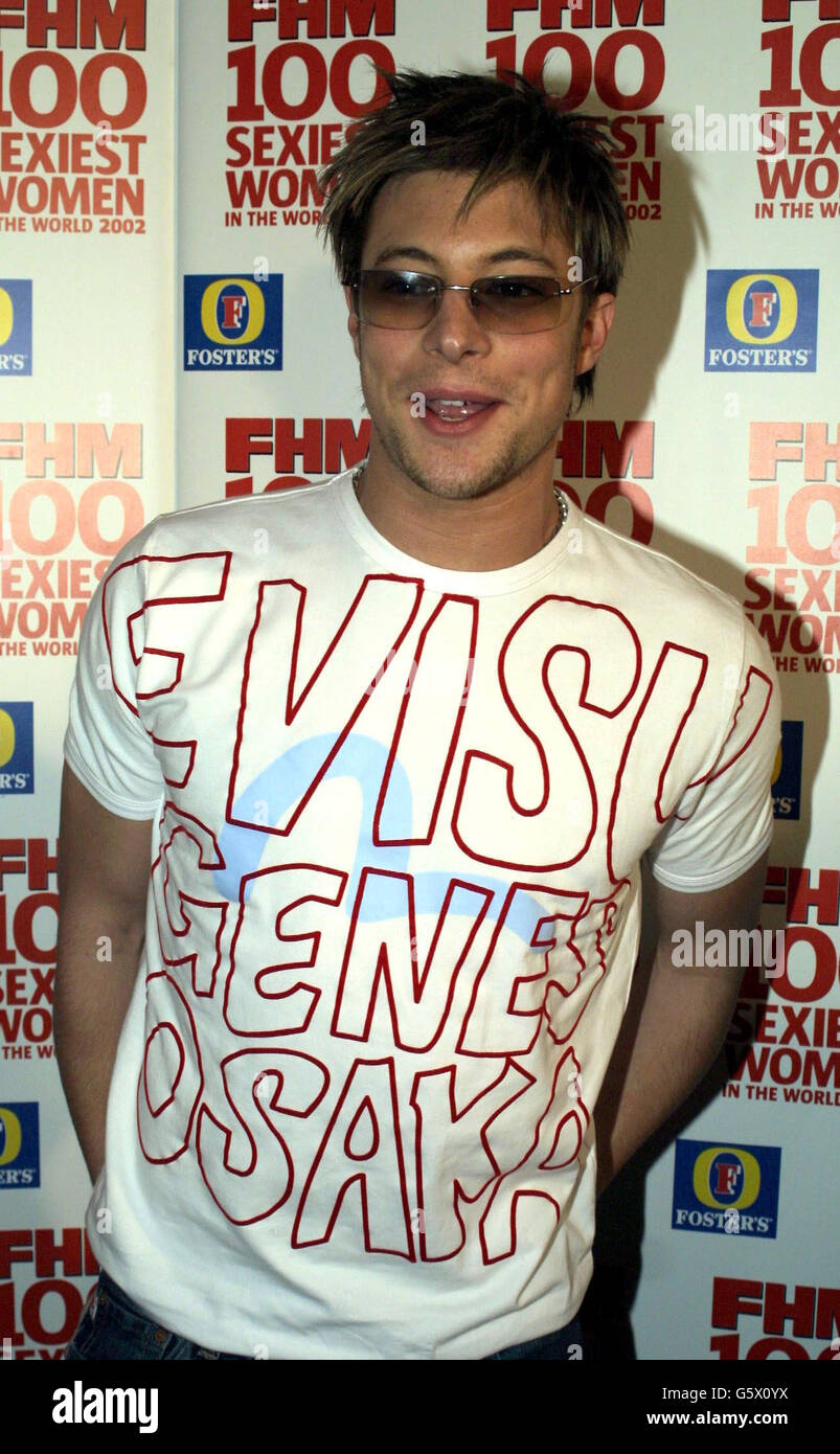 Celebrity singer sunglasses smiling 1 2 half length evisu top hi-res ...