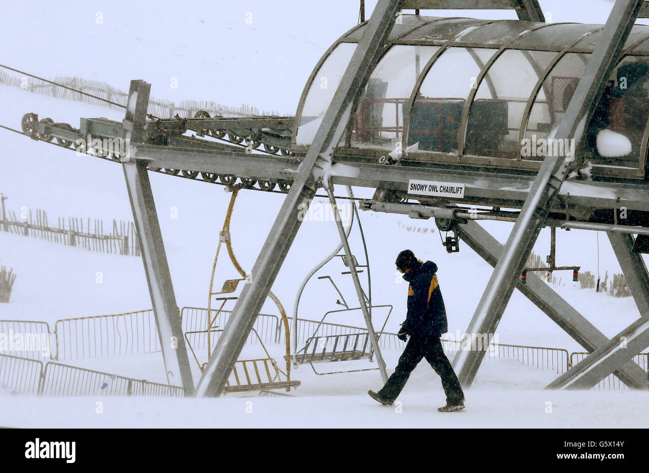People walk past the the ski lift where an accident occurred further up ...