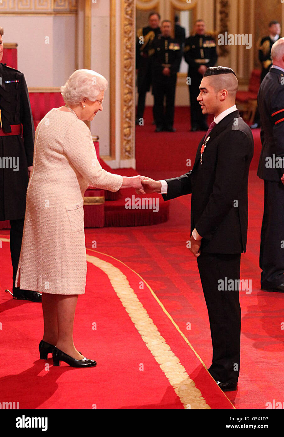 RETRANSMITED CORRECTING CAPTION Olympic gymnast Louis Smith receives ...