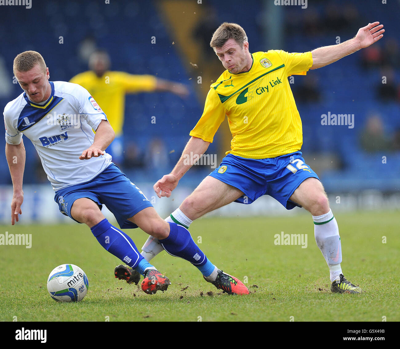 Bury's Joe Skarz (left) and Coventry City's Steven Jennings battle for ...