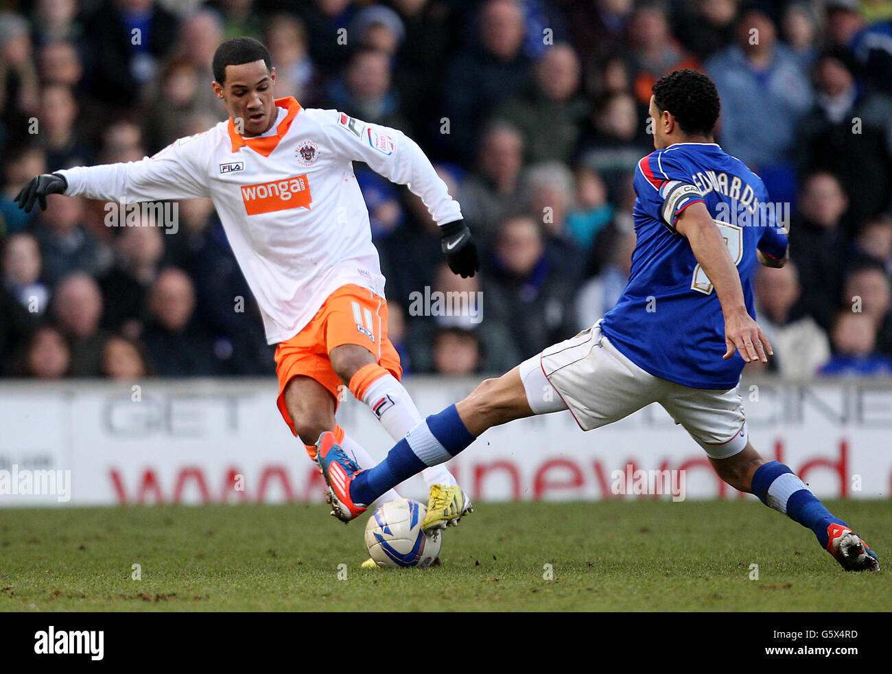 Blackpool's Tom Ince (left) and Ipswich Town's Carlos Edwards battle ...