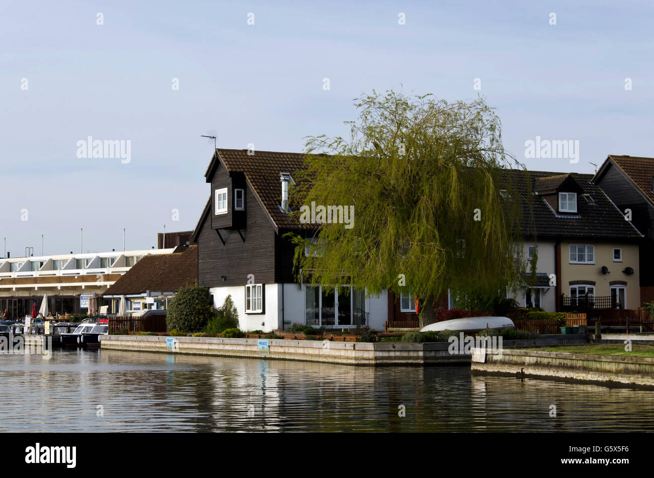 Modern houses with a water frontage at Wroxham on the River Bure in the ...