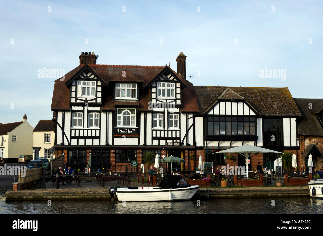 The Swan Inn public house on the banks of the River Bure in Horning in ...