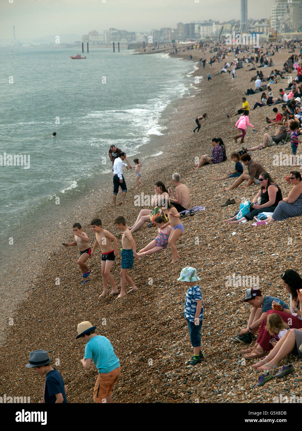 A busy day on the beach in Brighton Stock Photo - Alamy