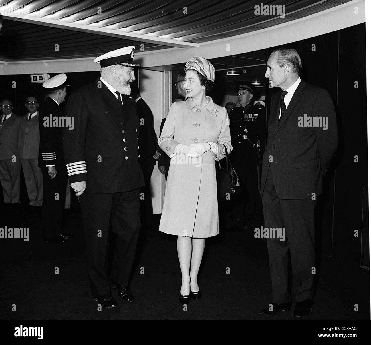 The Queen and Captain Bill Warwick, the Master of the QE2, on the ...